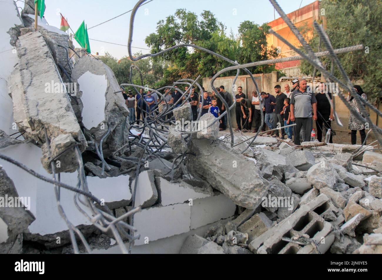 Palestinians inspect the house of Hassan Al-Rifai, following its ...