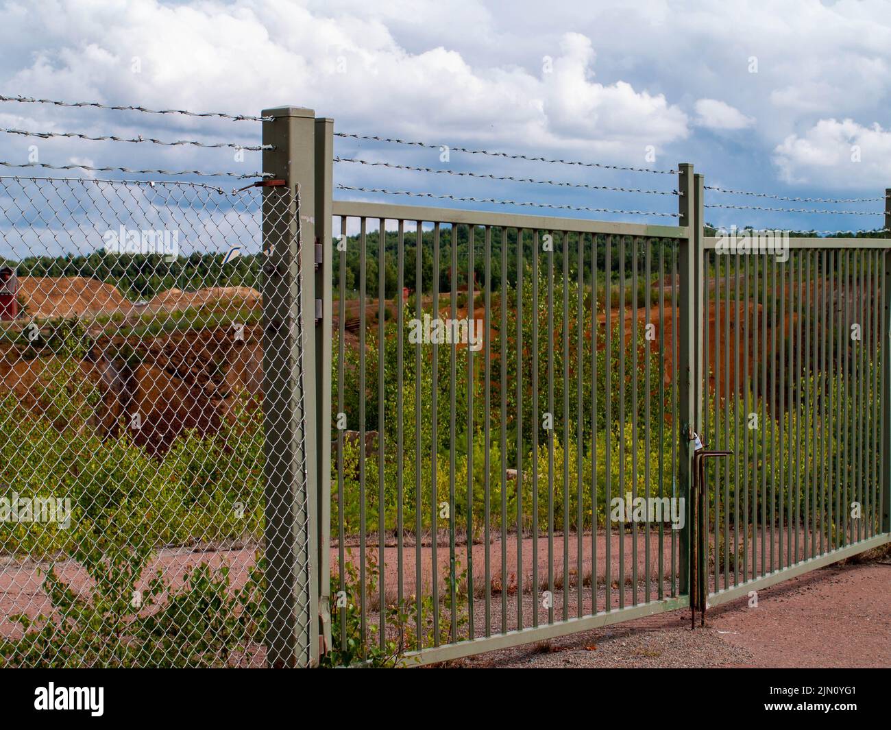 Closed gates at Falun Copper Mine World Heritage with barb wire fence ...