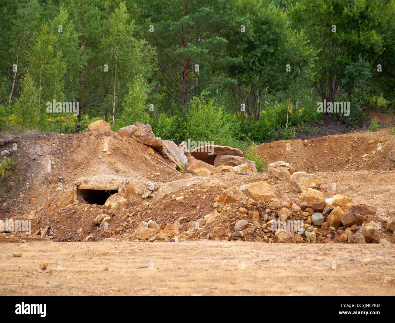 Mystierious cave opening in the distance in an orange post apocalyptic ...