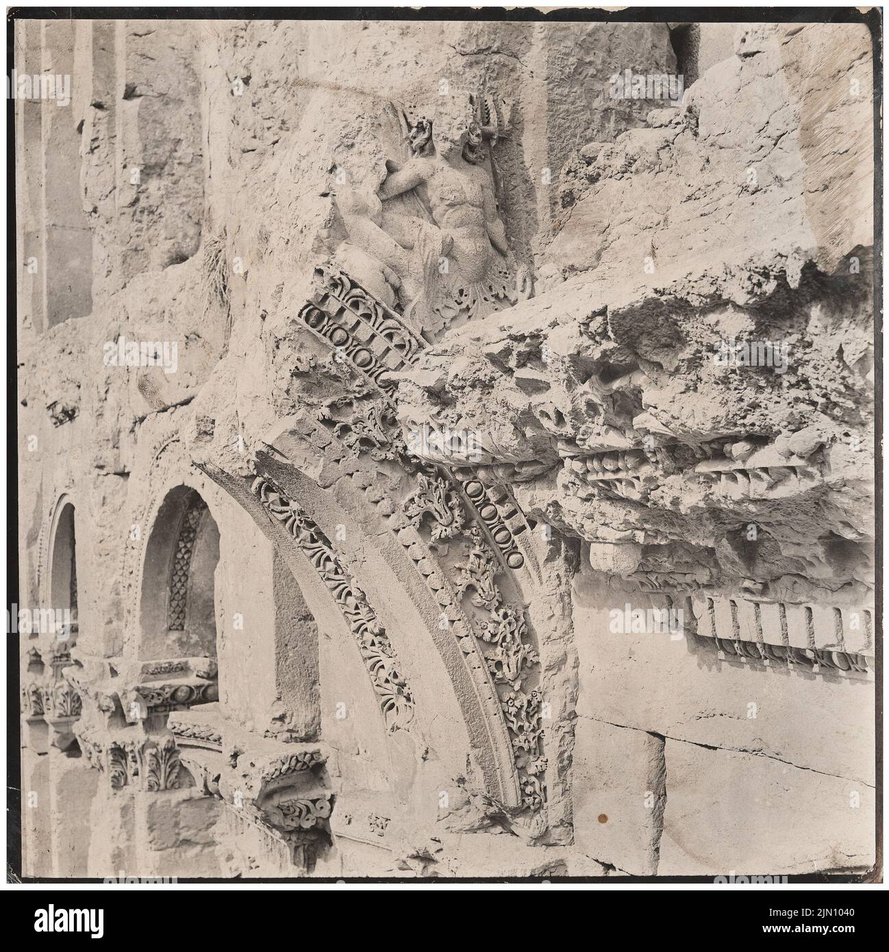 Unknown photographer, grotesque above a belt arc fragment in Baalbek ...