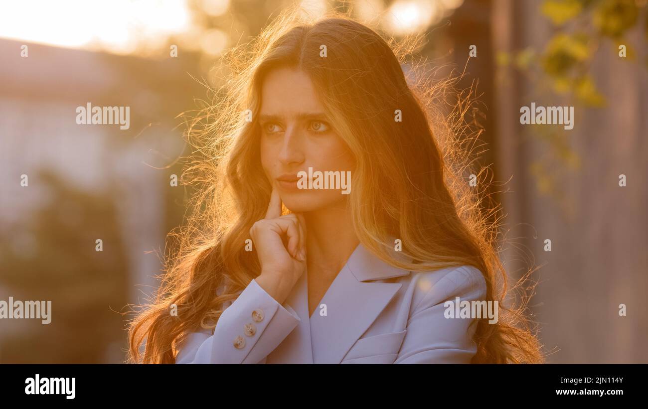 Caucasian pensive young business woman creative girl standing on ...