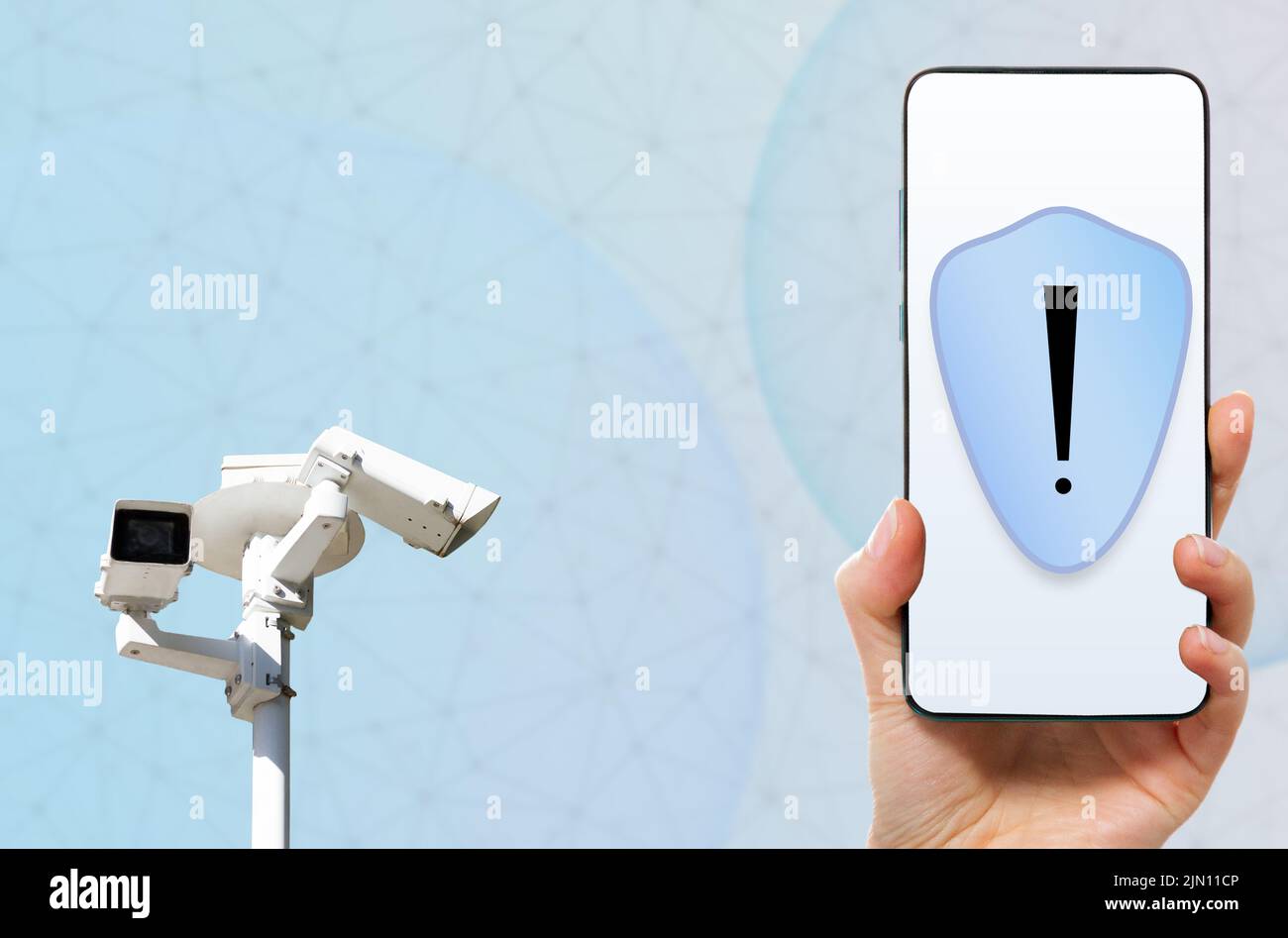 Supervision app and monitoring. Female hand holds a smartphone showing ...