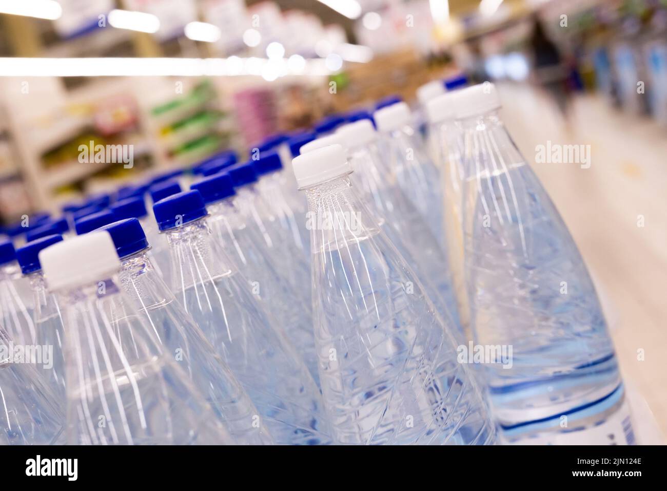 Bottled water in shop in hi-res stock photography and images - Alamy