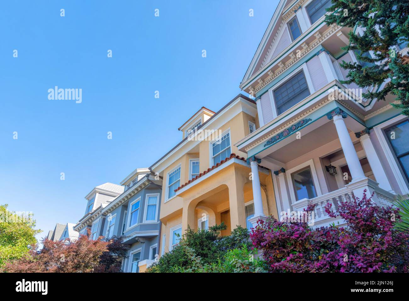 Row of houses in a low angle view with victorian and mediterranean ...