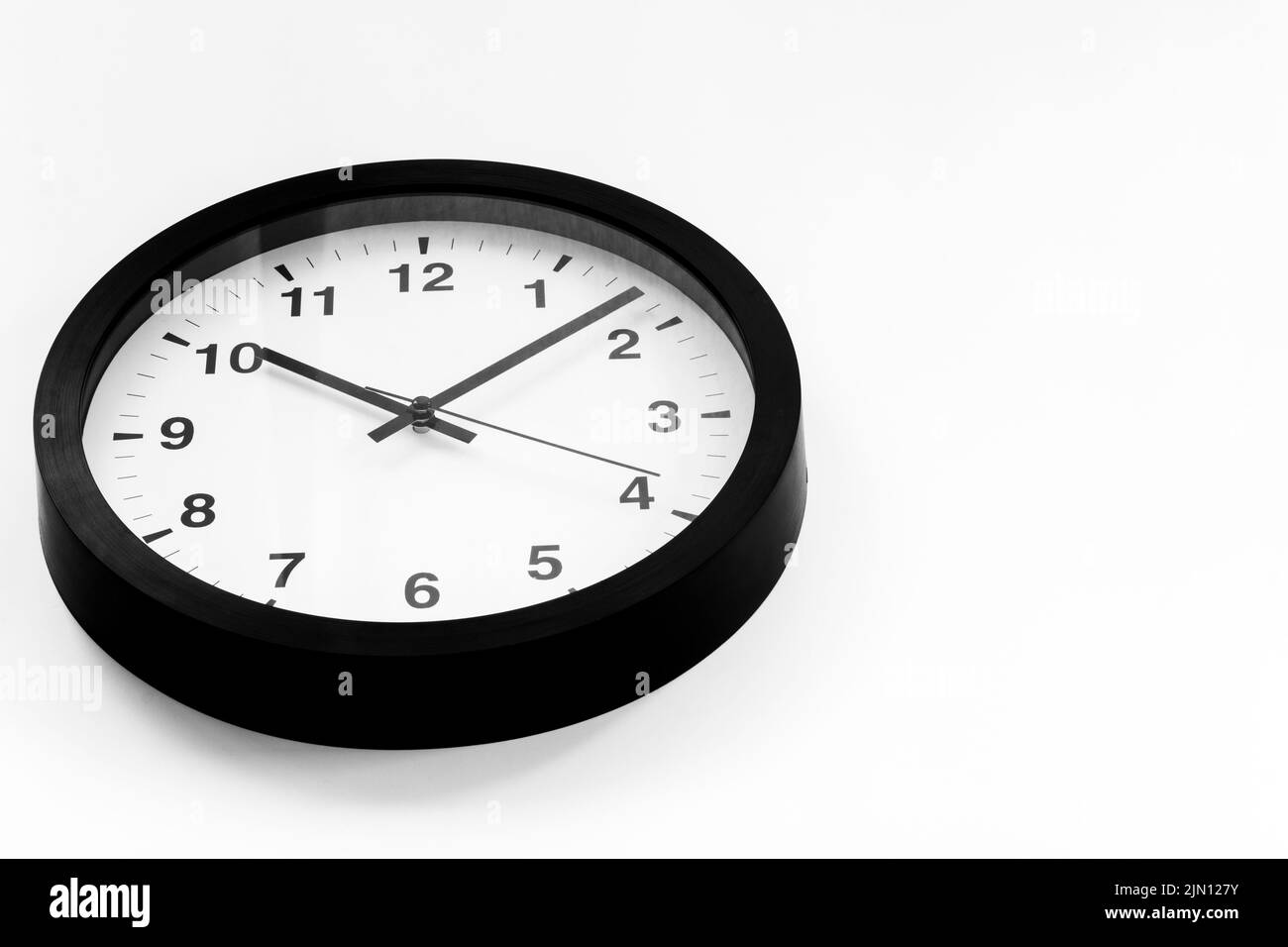 Office wall clock. Black and white clock - time to work concept Stock Photo - Alamy