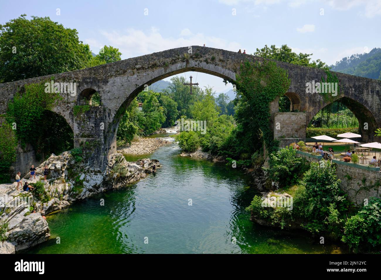 Roman hump-backed bridge on the Sella River in Cangas de Onis, Asturias ...