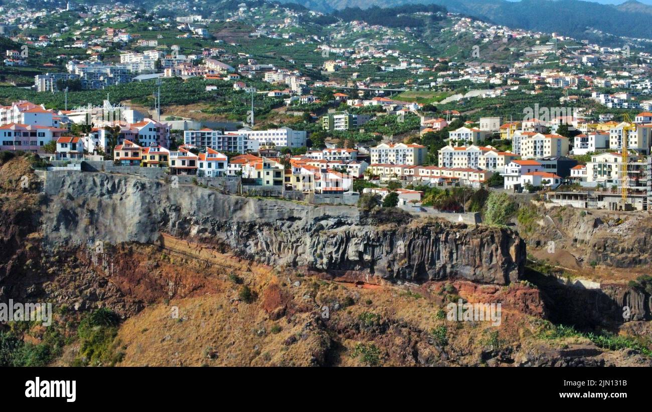 An aerial view of modern buildings surrounded by trees Stock Photo - Alamy