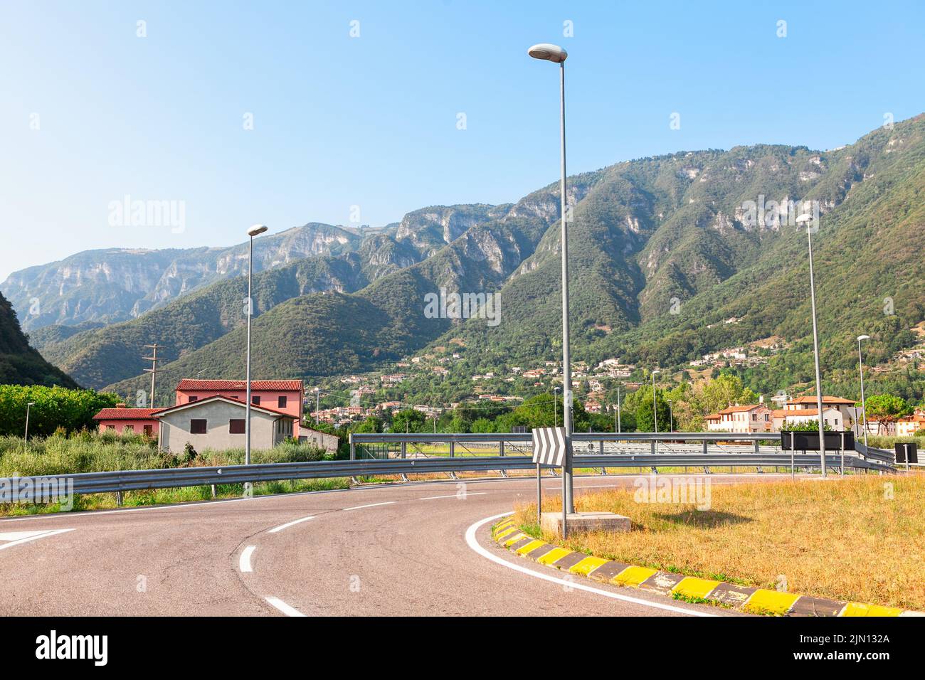 Winding highway and Italian Alps . Road and mountains in Italy Stock ...