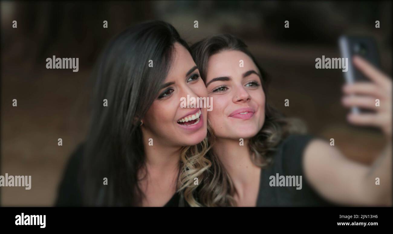 Girlfriends Taking Selfie Sticking Tongue Out Young Women Posing For