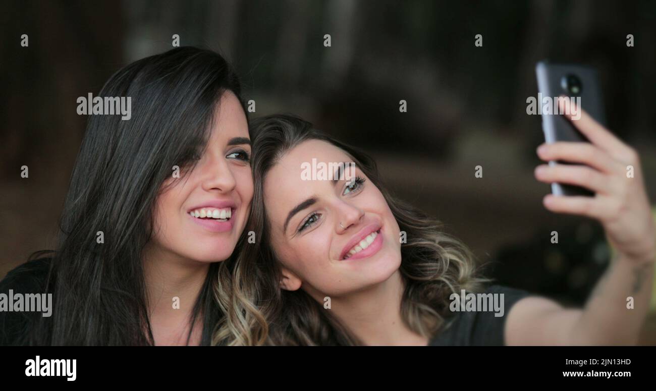 Girlfriends Taking Selfie Sticking Tongue Out Young Women Posing For