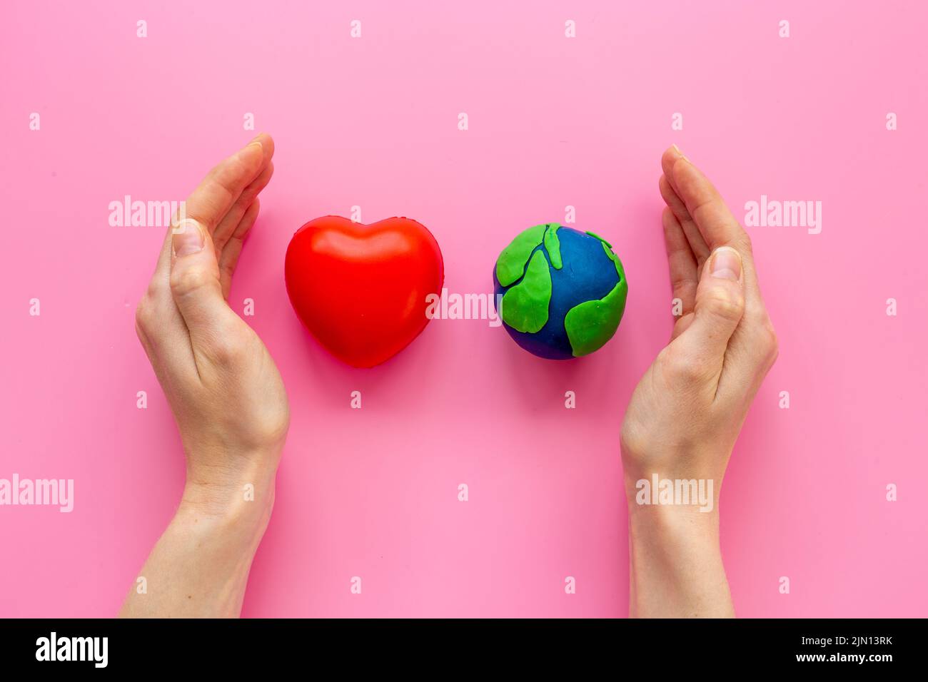 Plasticine world - planet Earth in hands. Eco care concept Stock Photo ...