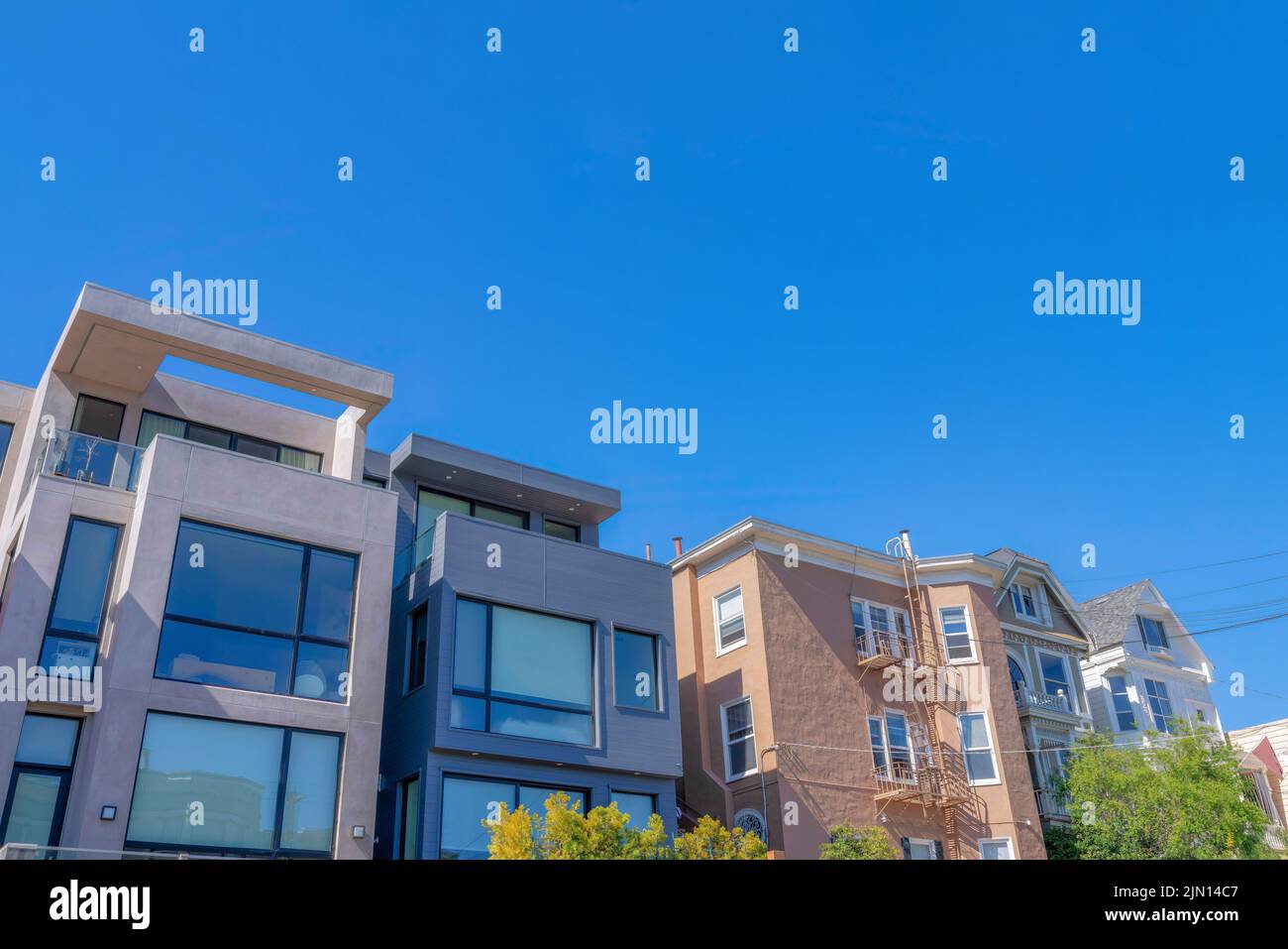 Modern and traditional houses in a low angle view in San Francisco, CA ...