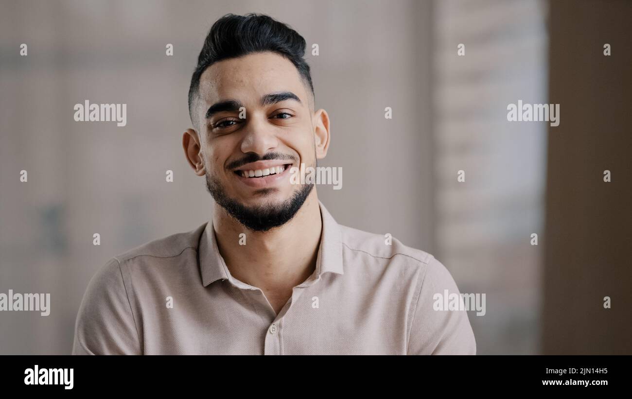 Portrait of confident calm young man arabic ethnic male handsome brunet ...