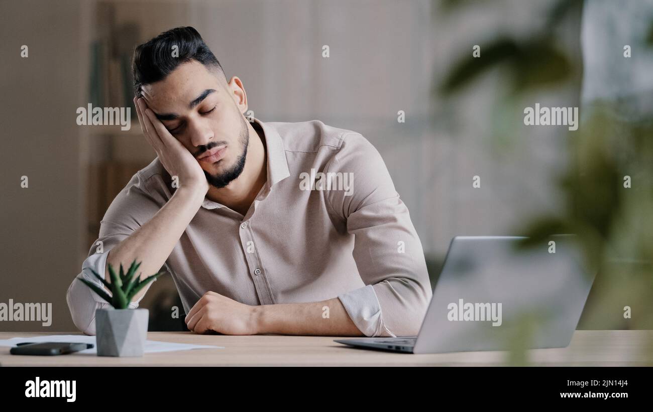 Tired sleepy hispanic man arab guy dreaming overworked male student ...