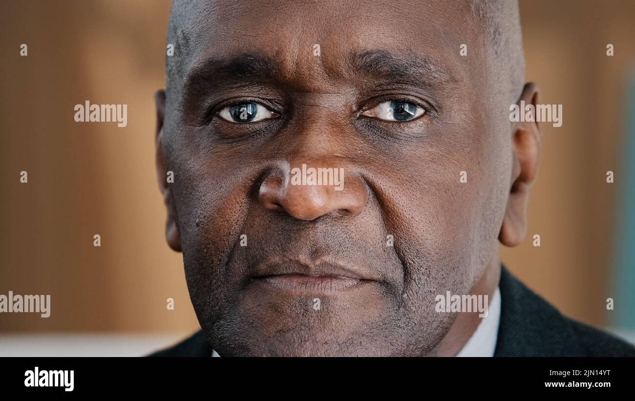 Portrait indoors sad serious mature African man in male face successful ...