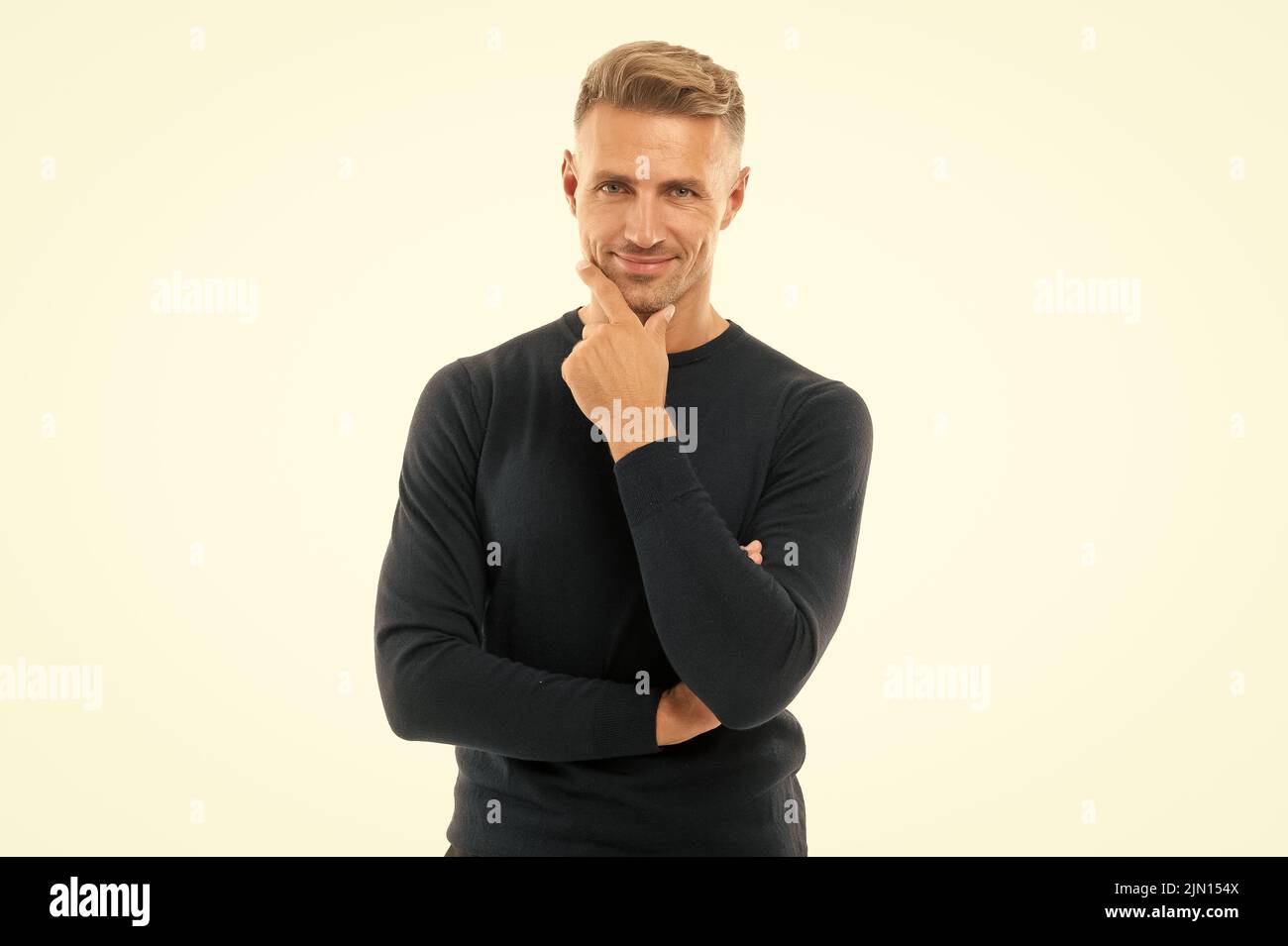 Happy thoughtful man in black sweatshirt stroke chin thinking isolated ...