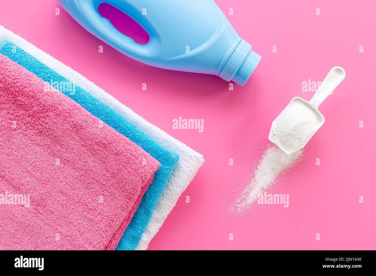White washing powder with towels and a laundry conditioner bottle Stock ...