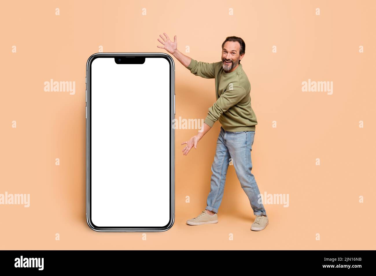 Full body portrait of crazy cheerful man arms demonstrate empty space ...