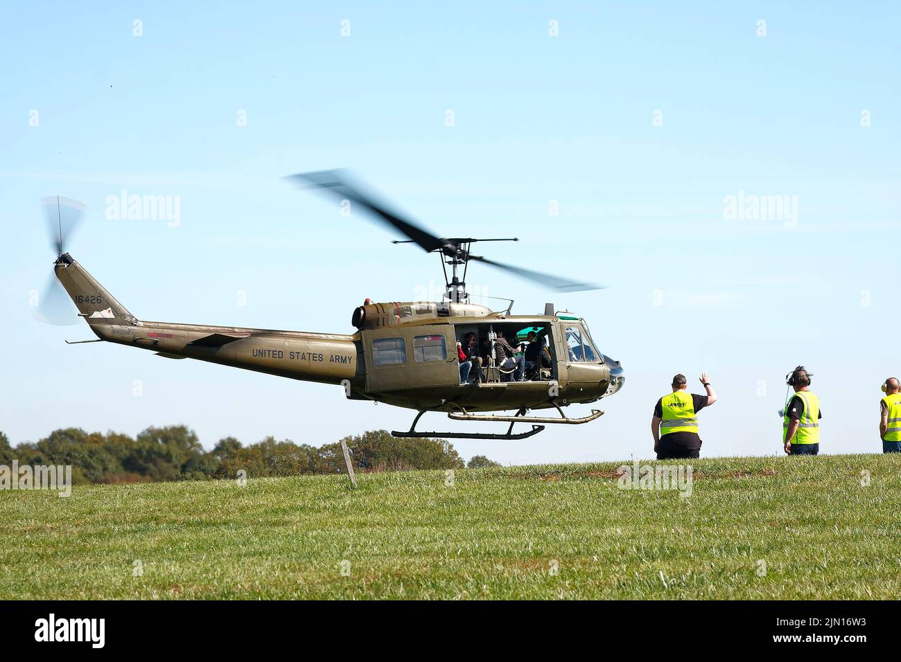 helicopter close to landing, U.S. Army, grass field, rotary-wing ...