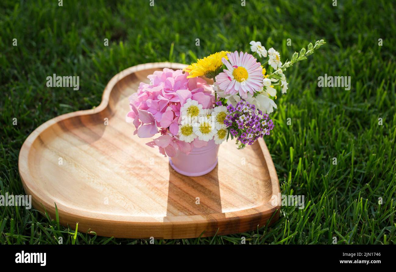 mini flower bouquet of various multi-colored flowers in a small metal ...