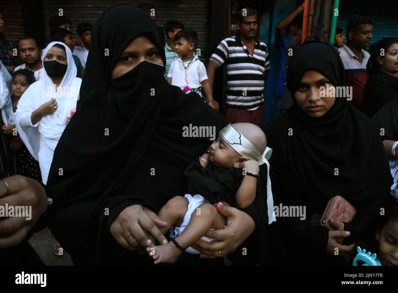 Shia Muslims participate in a religious procession on the 8th day of ...