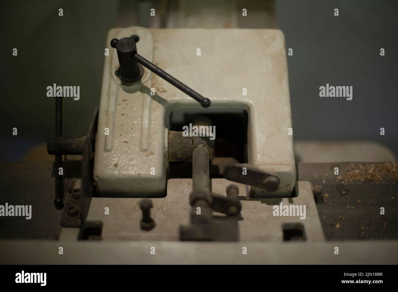 Iron lever mechanism. Old thing in garage. Steel block with lever ...