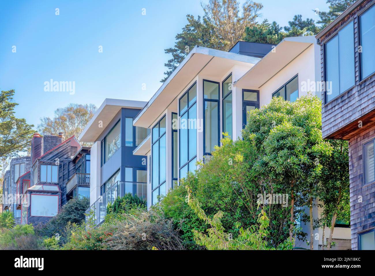 Row of large houses with tall picture windows at San Francisco ...