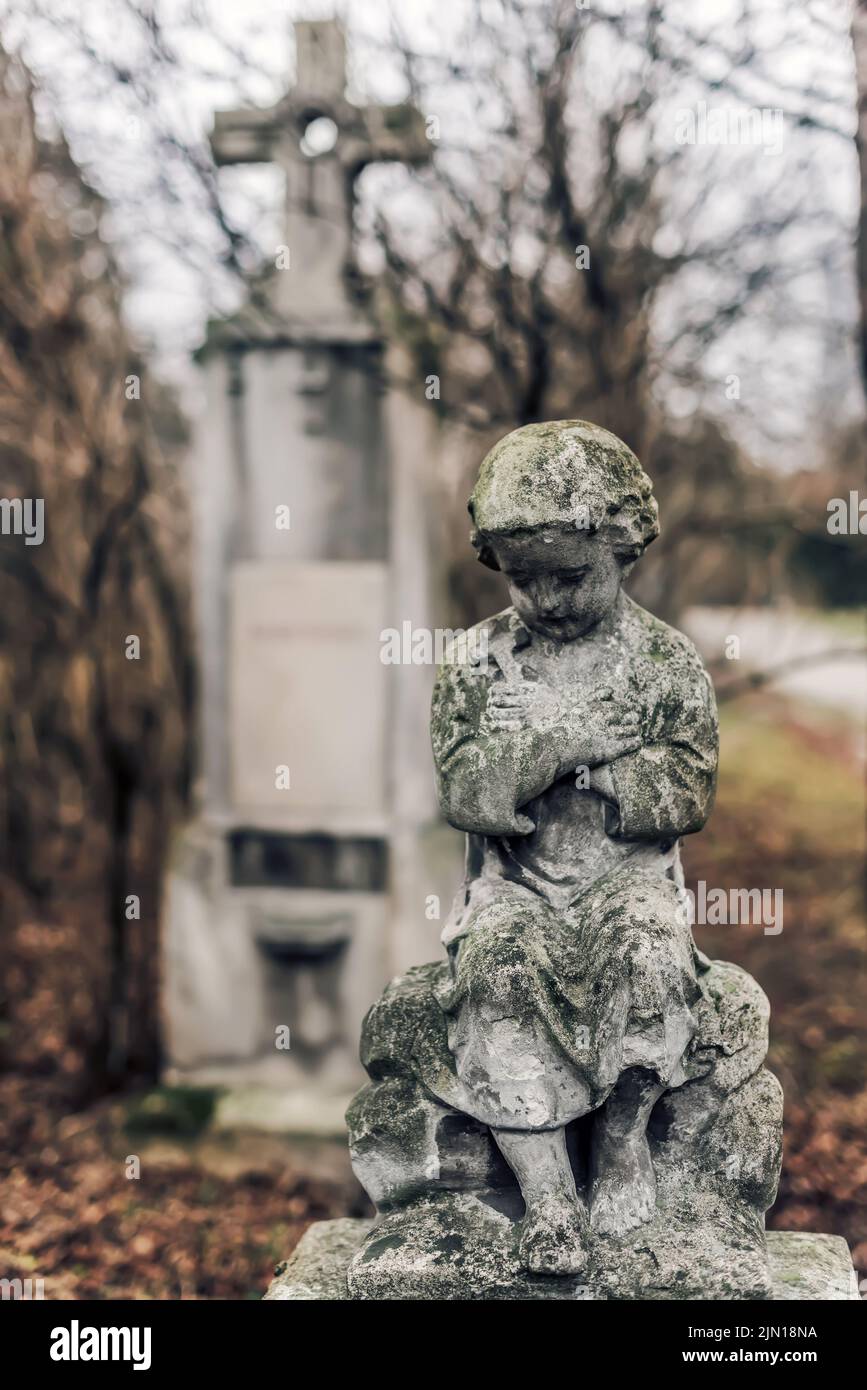 Child Grave Sculpture in Old European Cemetery Stock Photo - Alamy