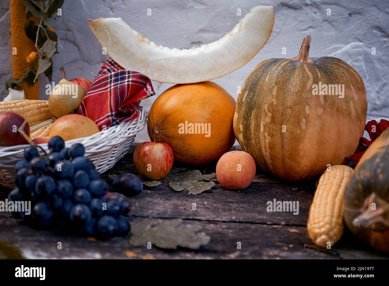 Autumn aesthetic still life: yellow fruits and vegetables, pumpkin ...