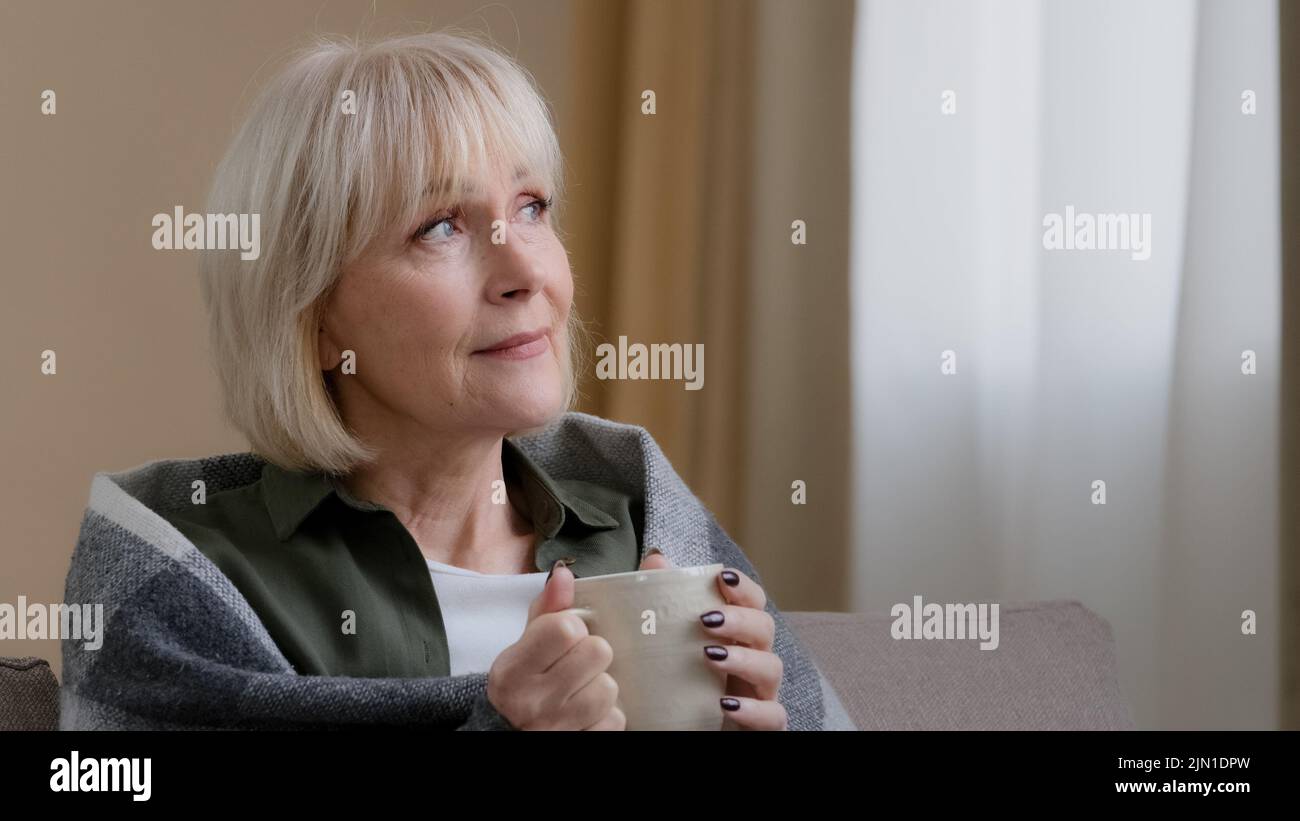 Side view african american old 60s lonely business man drinking coffee ...