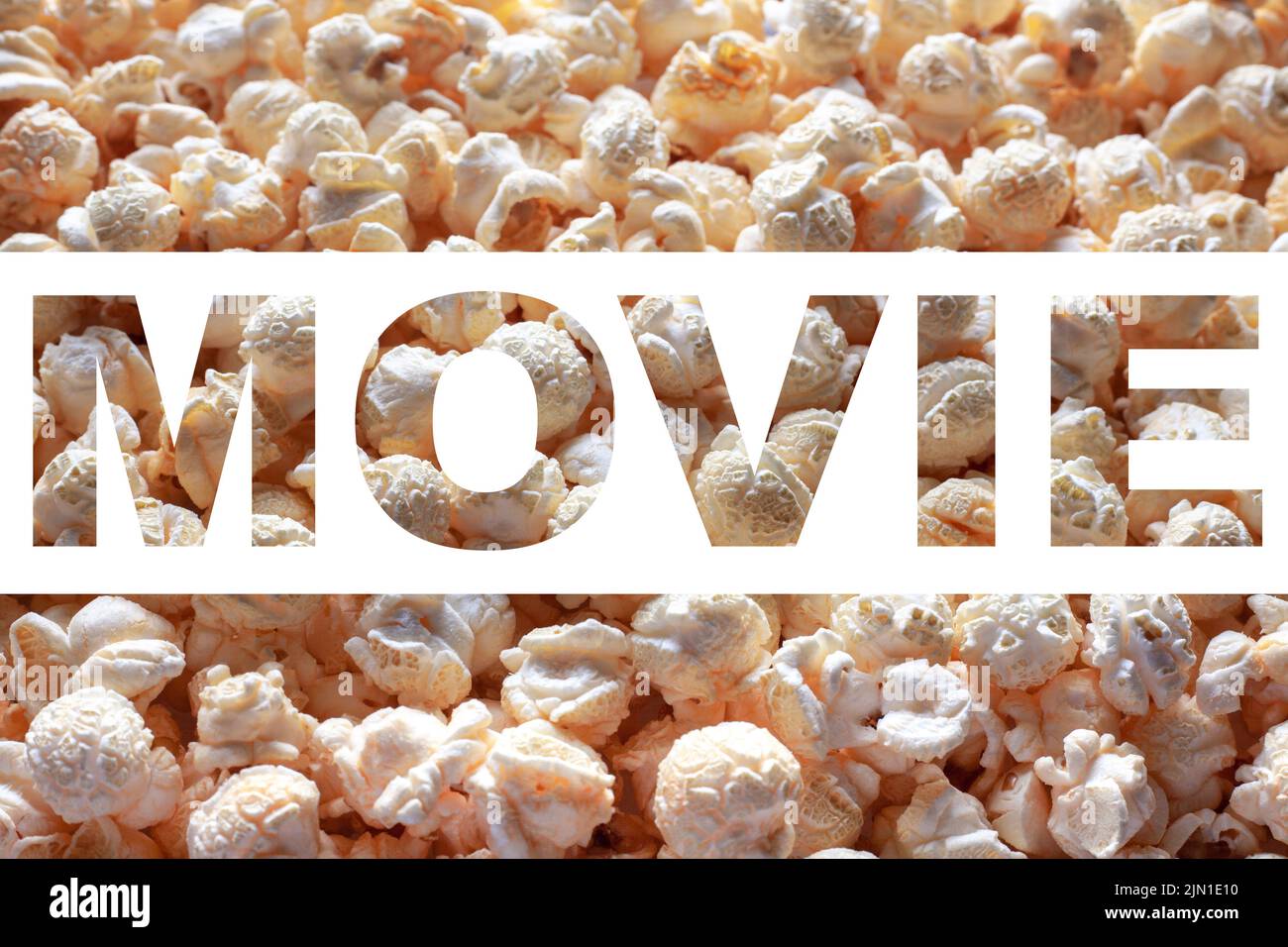 Popcorn texture background with inscription MOVIE. Word MOVIE on white ...