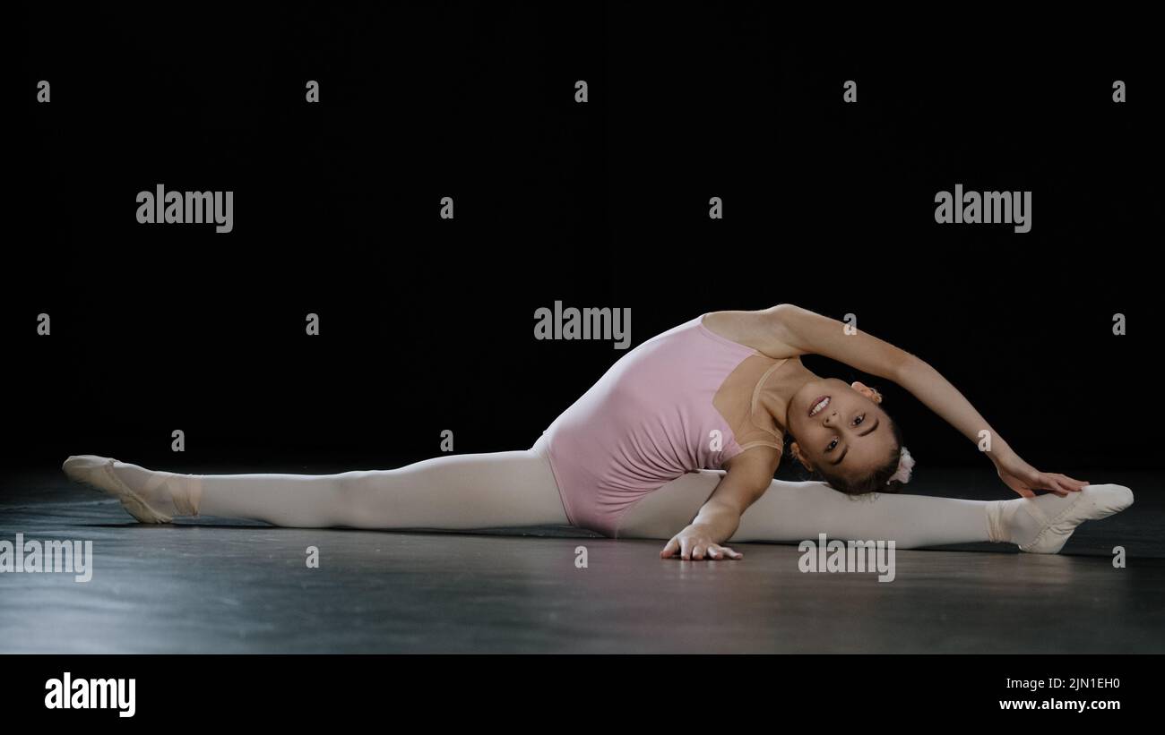 Teenager motivated flexible professional acrobat ballerina dancer girl ...