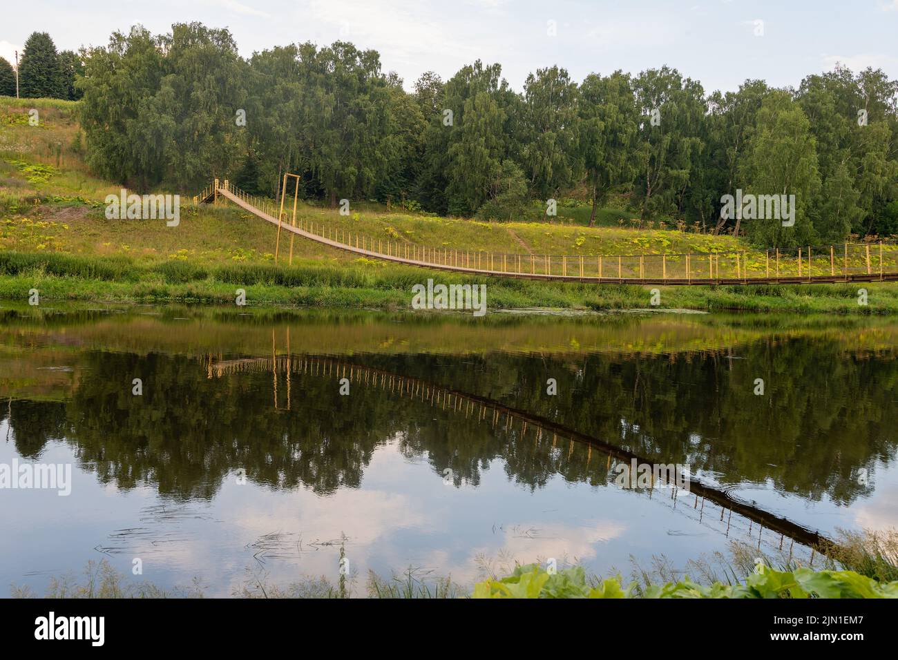 Moscow region. The suspension bridge through the Moskva River connects ...
