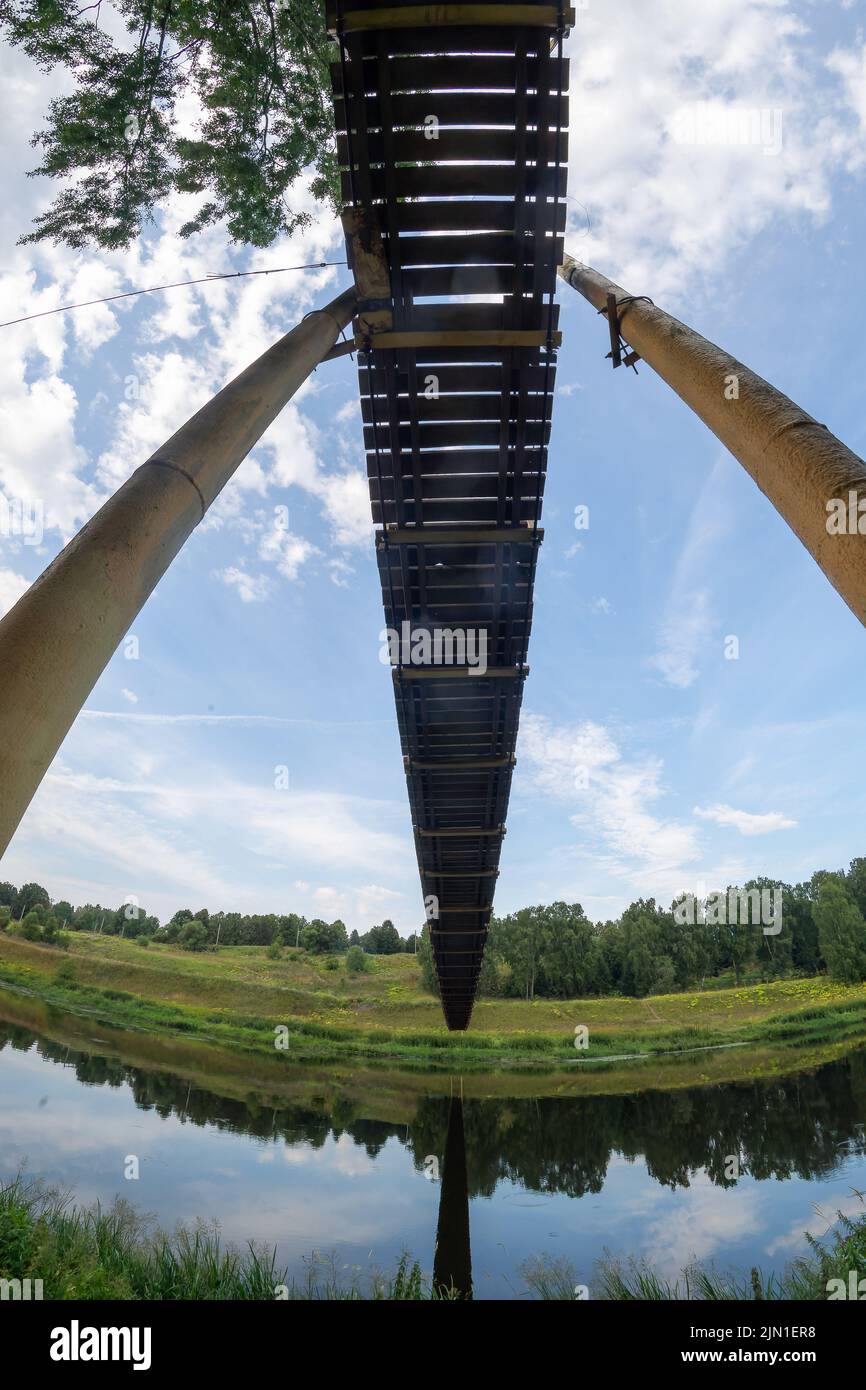 Moscow region. The suspension bridge through the Moskva River connects ...