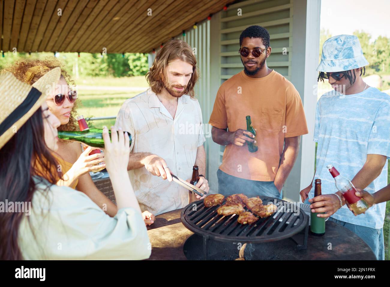 Diverse friends eating chicken hi-res stock photography and images - Alamy