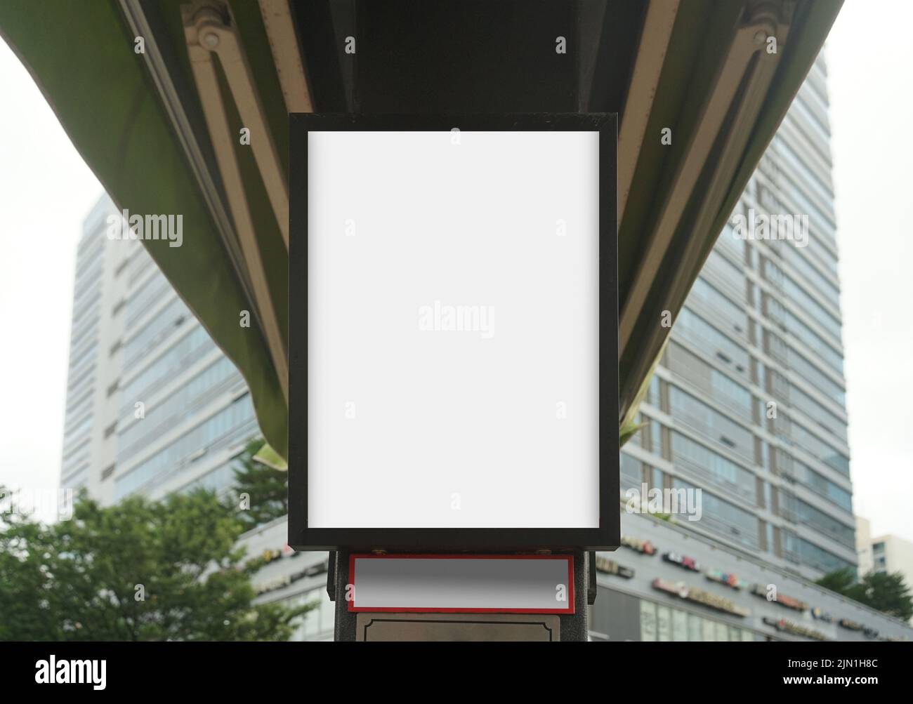 Photographs of a large building and an empty advertising mokup Stock ...