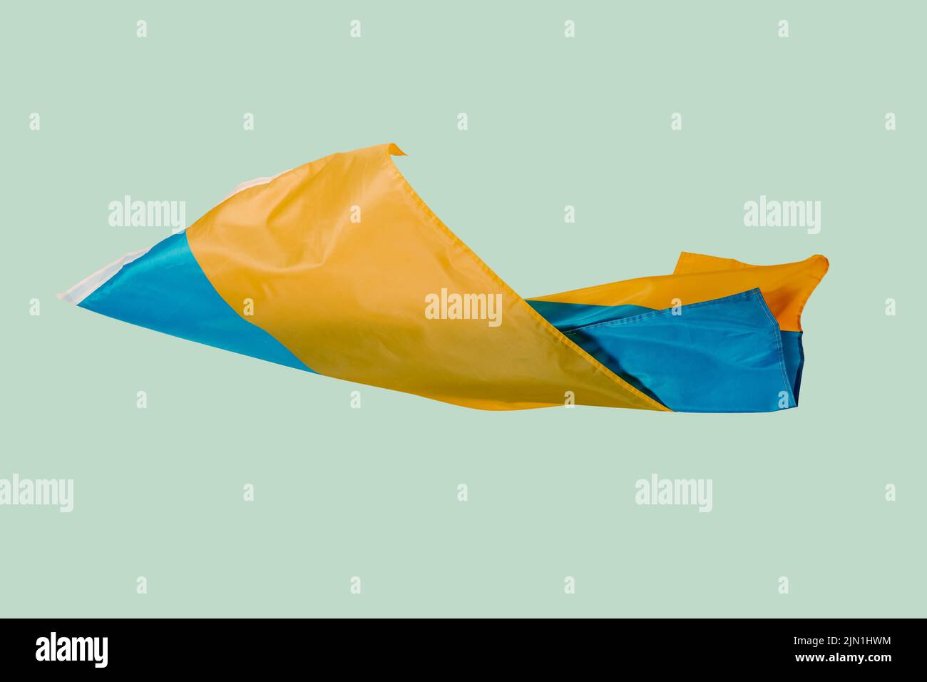 the ukrainian flag flying on a pale green background Stock Photo - Alamy