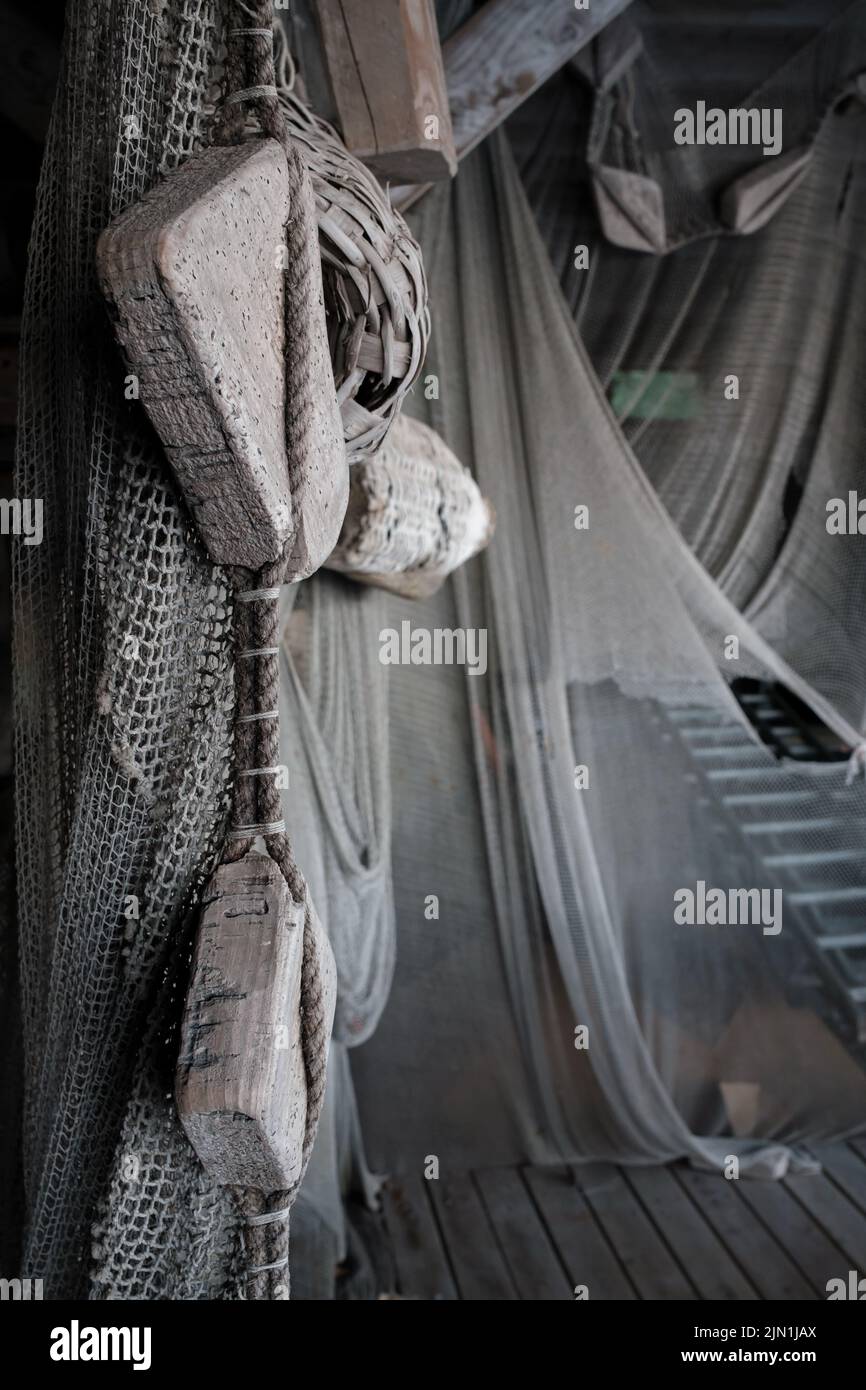 Old fishing nets hung along the walls background Stock Photo - Alamy