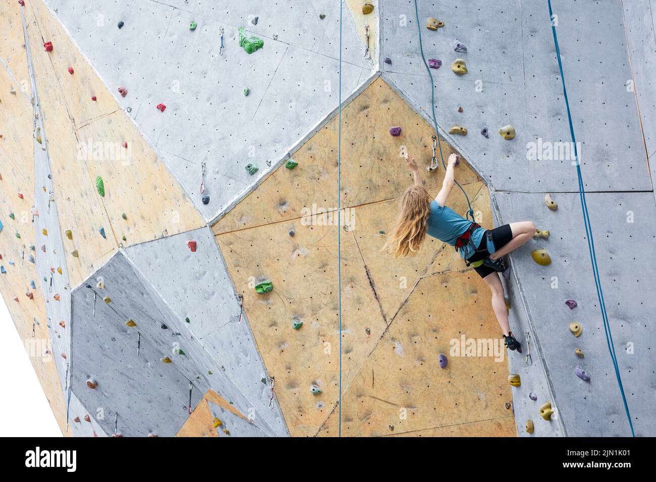 sport. bouldering, teen girl climbing up the wall Stock Photo - Alamy