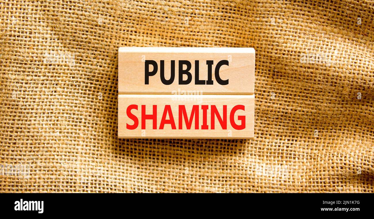 Public shaming symbol. Concept words Public shaming on wooden blocks on ...
