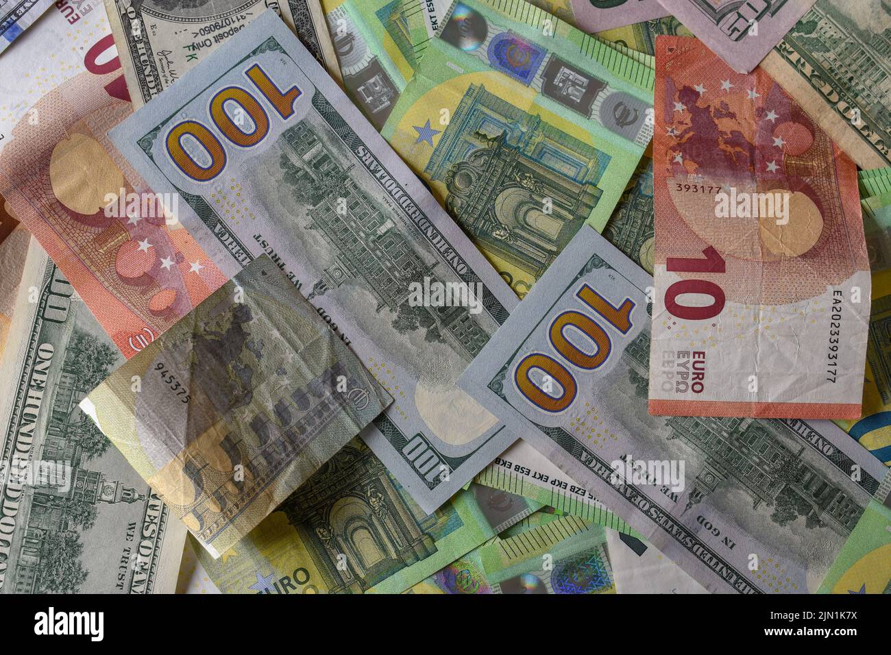 money mixed euro and dollar bills on a table Stock Photo - Alamy