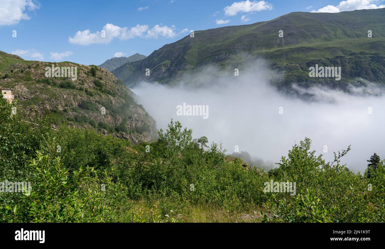 cloud rising up the valley below the barrage des gloriettes, a large ...