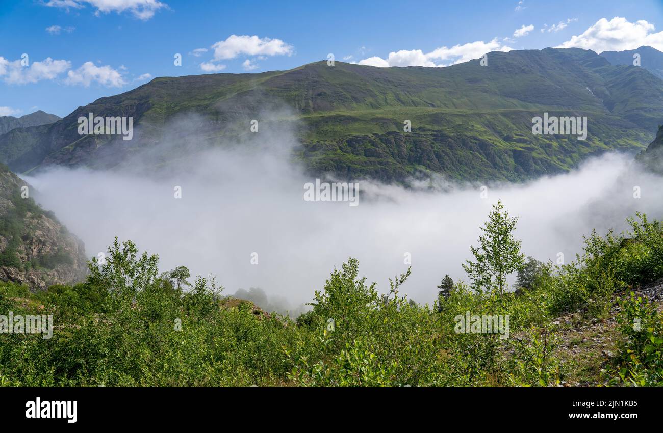 cloud rising up the valley below the barrage des gloriettes, a large ...
