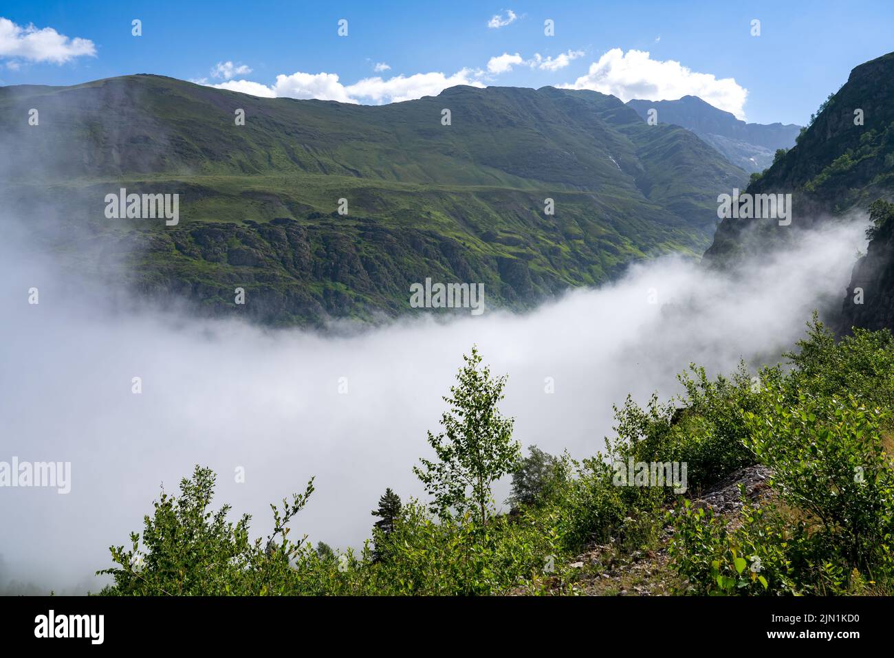 cloud rising up the valley below the barrage des gloriettes, a large ...