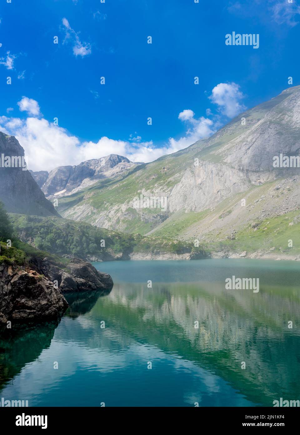 mist rolls across the barrage des gloriettes, a large reservoir and dam ...