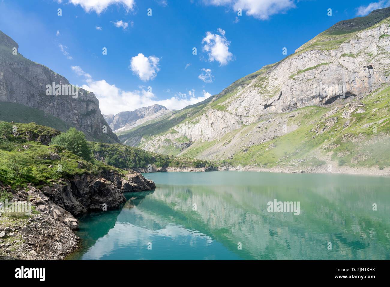 mist rolls across the barrage des gloriettes, a large reservoir and dam ...