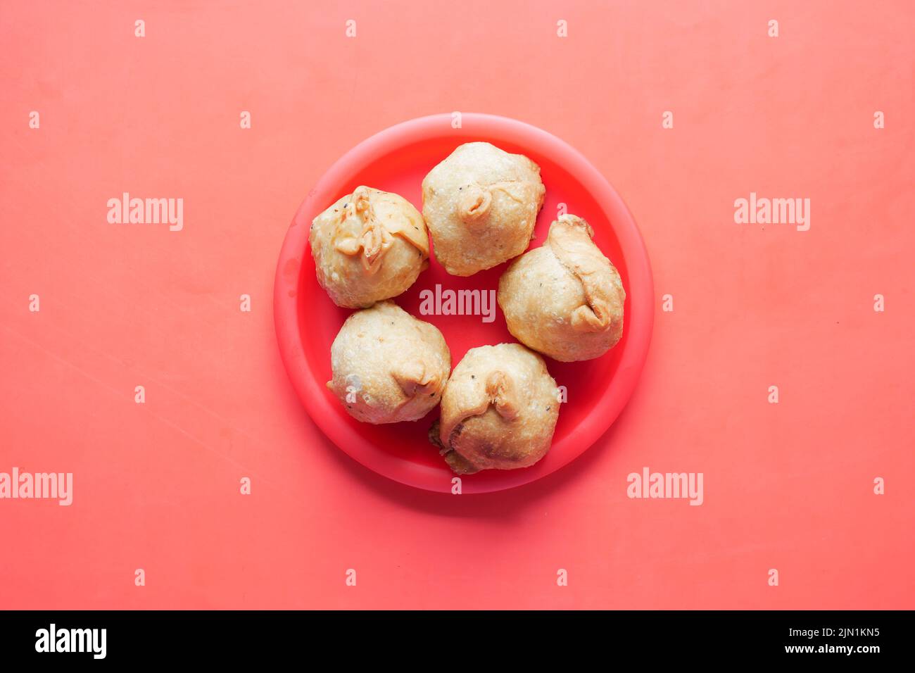 top view of indian food singara on plate on red background Stock Photo ...