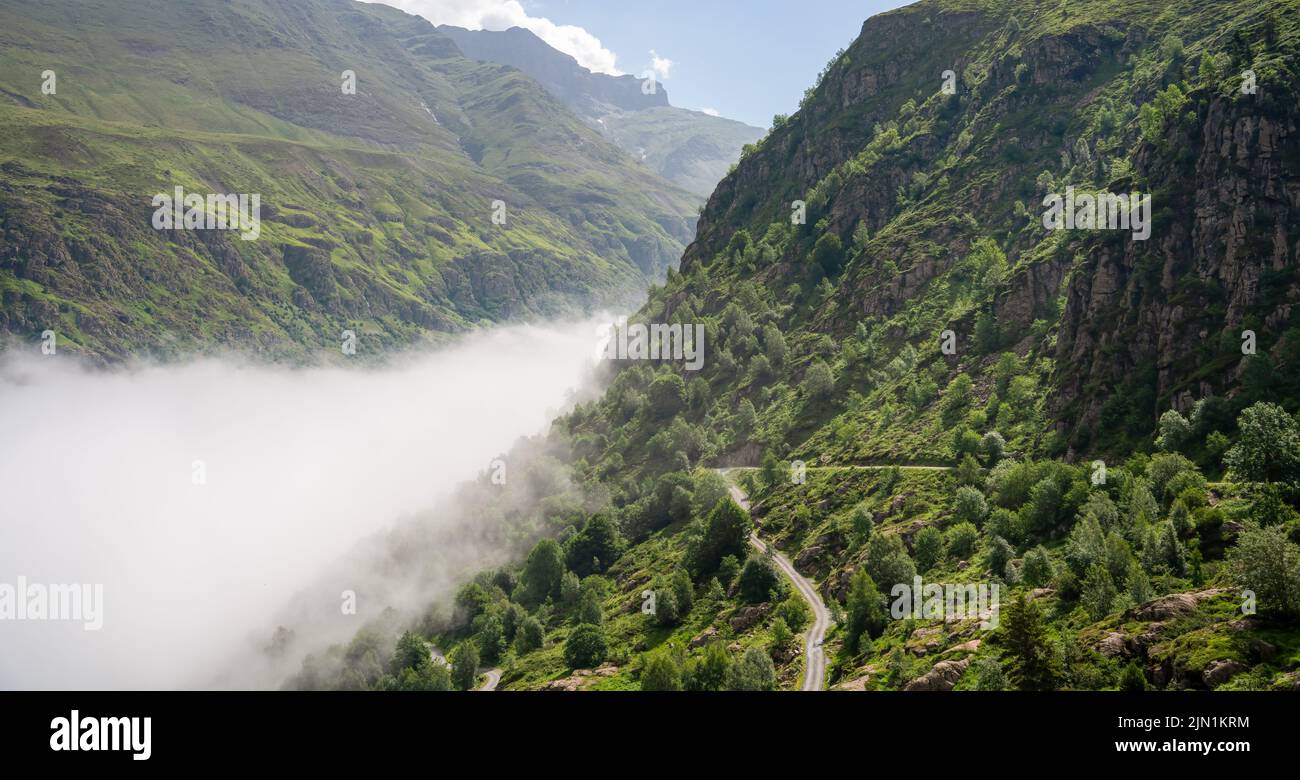 cloud rising up the valley below the barrage des gloriettes, a large ...