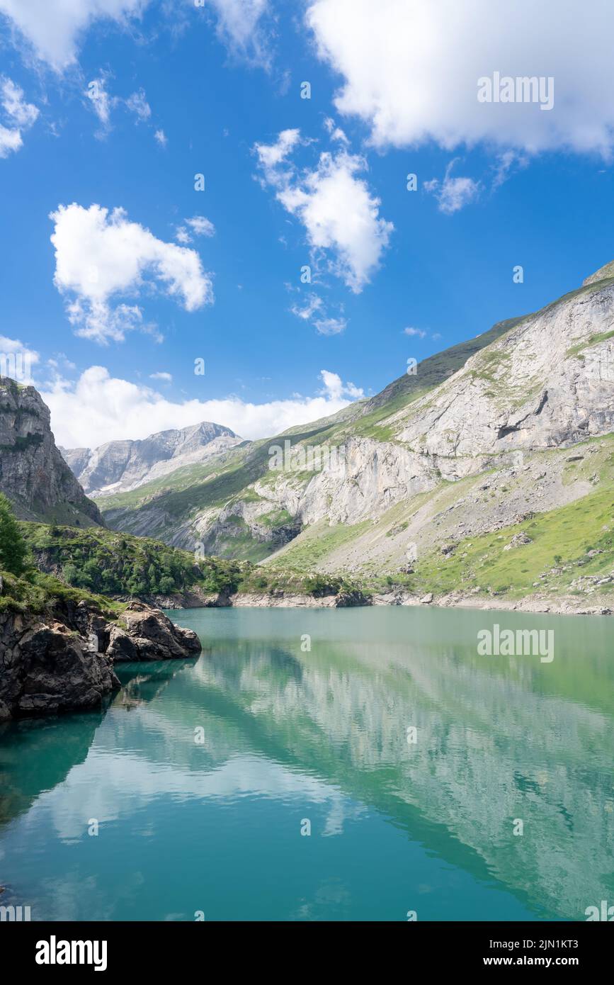 mist rolls across the barrage des gloriettes, a large reservoir and dam ...