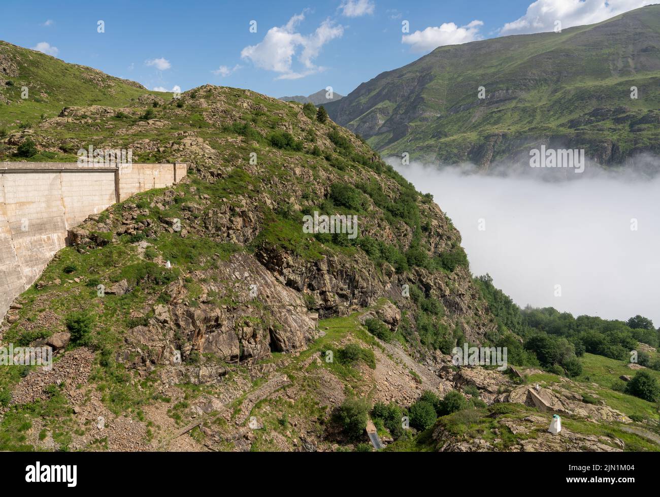 cloud rising up the valley below the barrage des gloriettes, a large ...